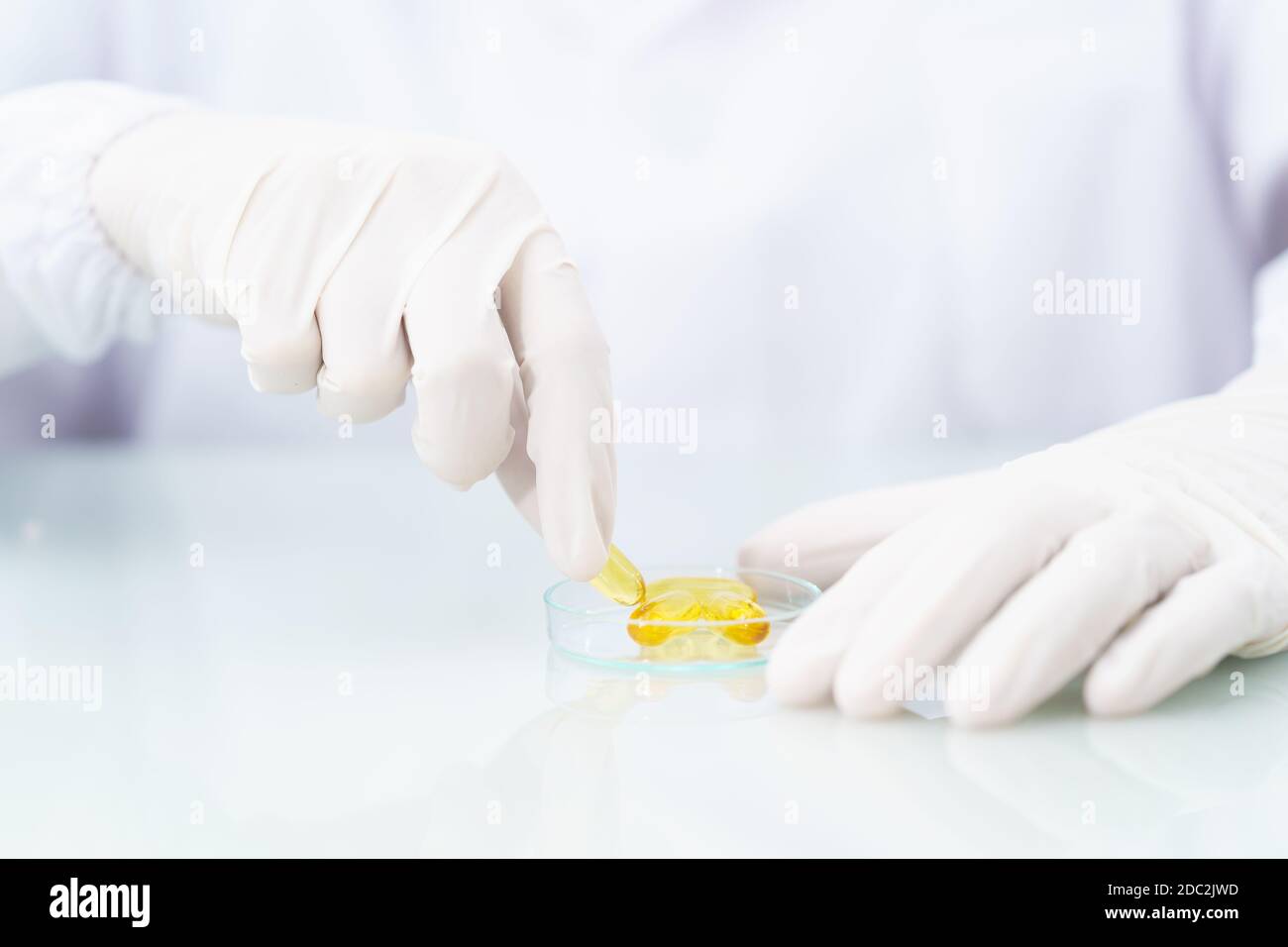 Close up Scientist hands putting in nitrile latex gloves holding Omega ...