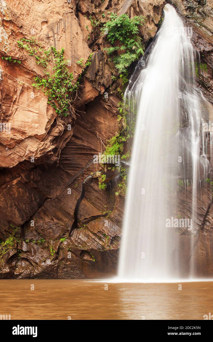 Gorgeous waterfall on grand sandstone wall in rain season, abstract ...