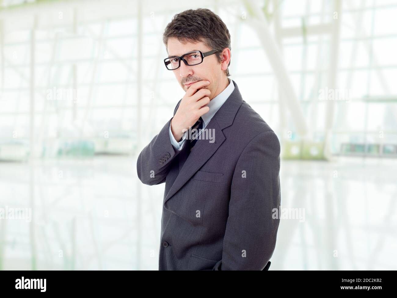 young business man thinking, at the office Stock Photo - Alamy