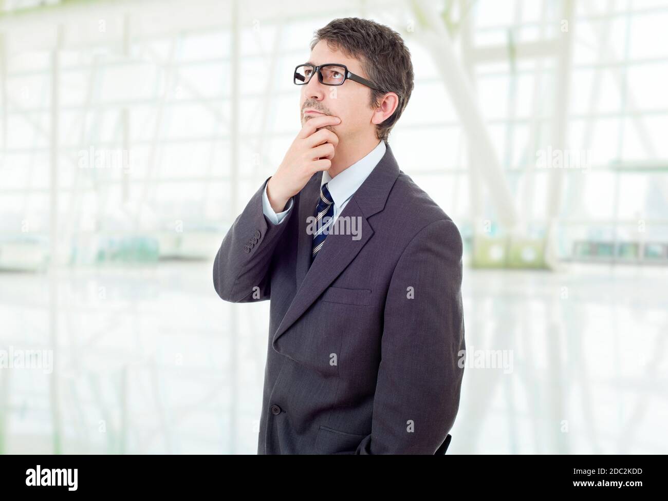 young business man thinking, at the office Stock Photo - Alamy