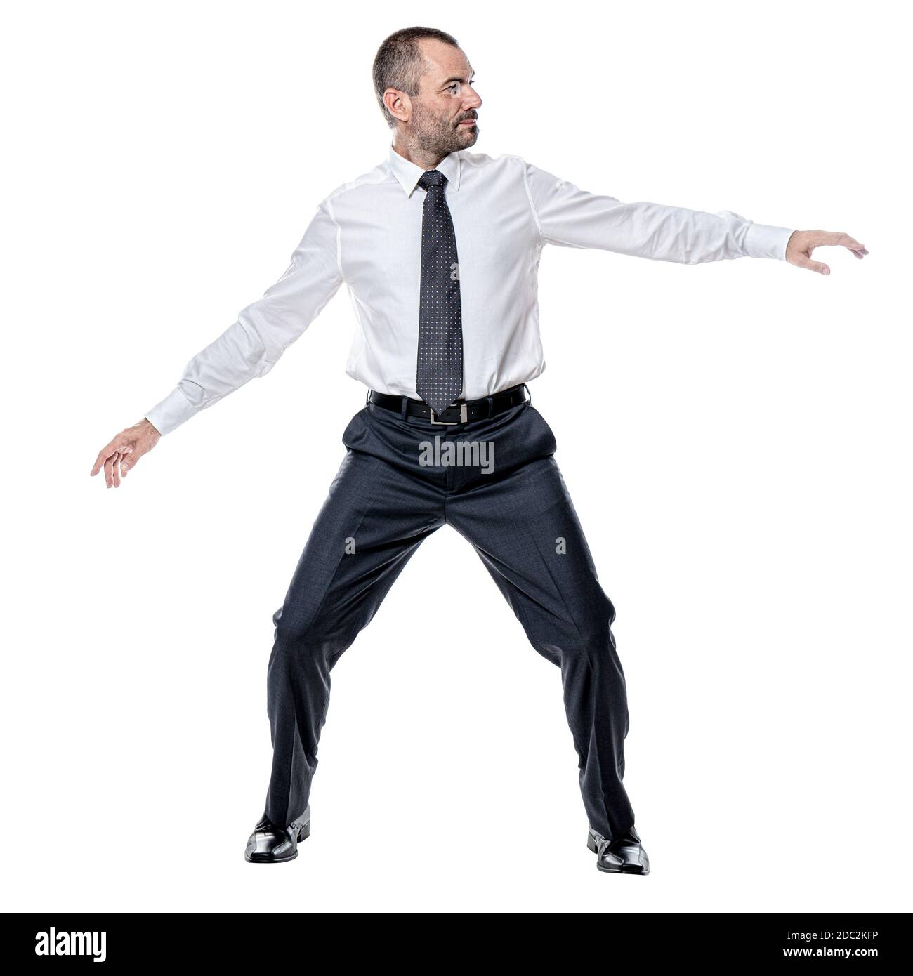 businessman keeping balance, side view isolated on white Stock Photo ...