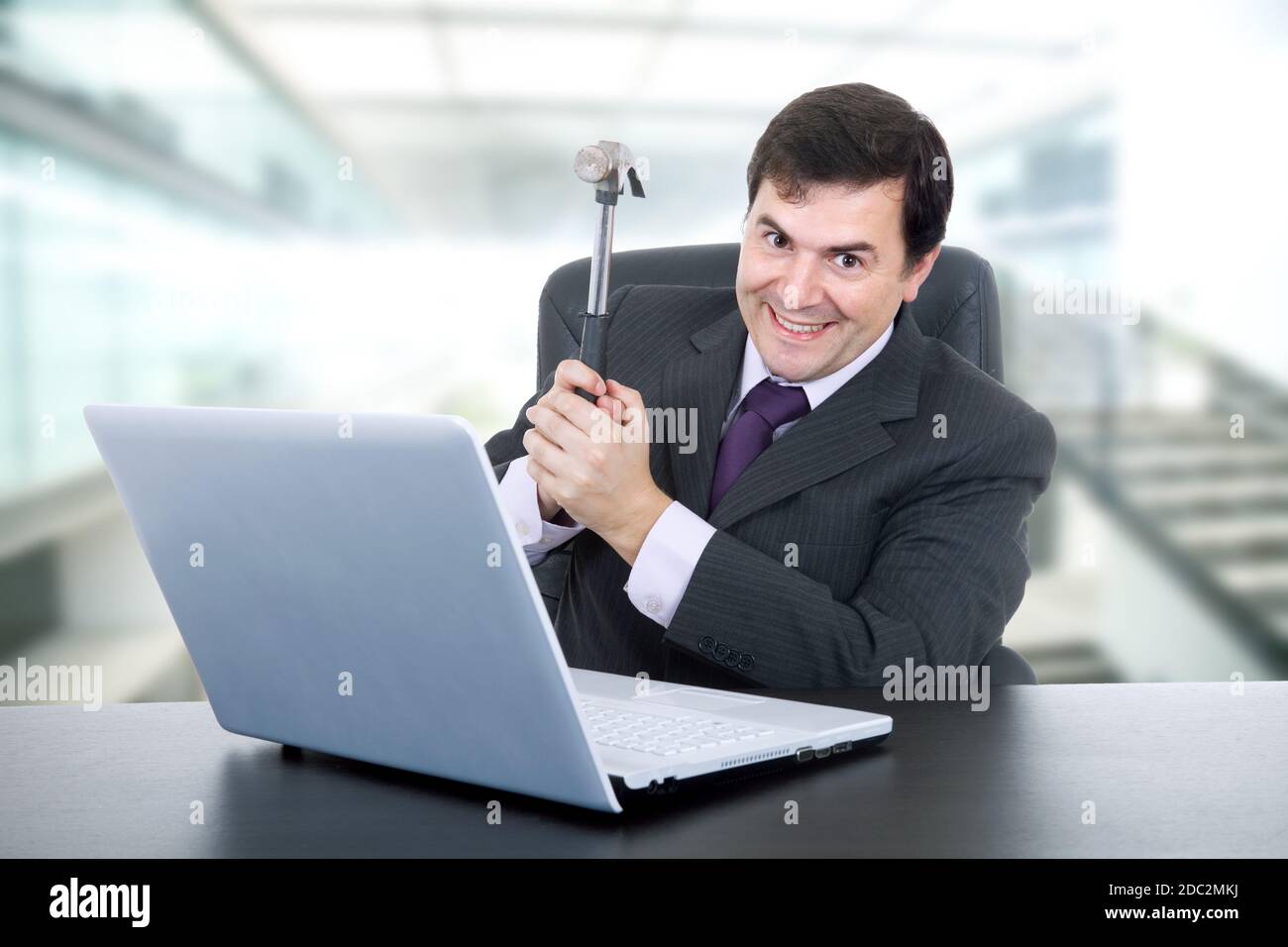 Man smashing computer with hammer hi-res stock photography and images ...