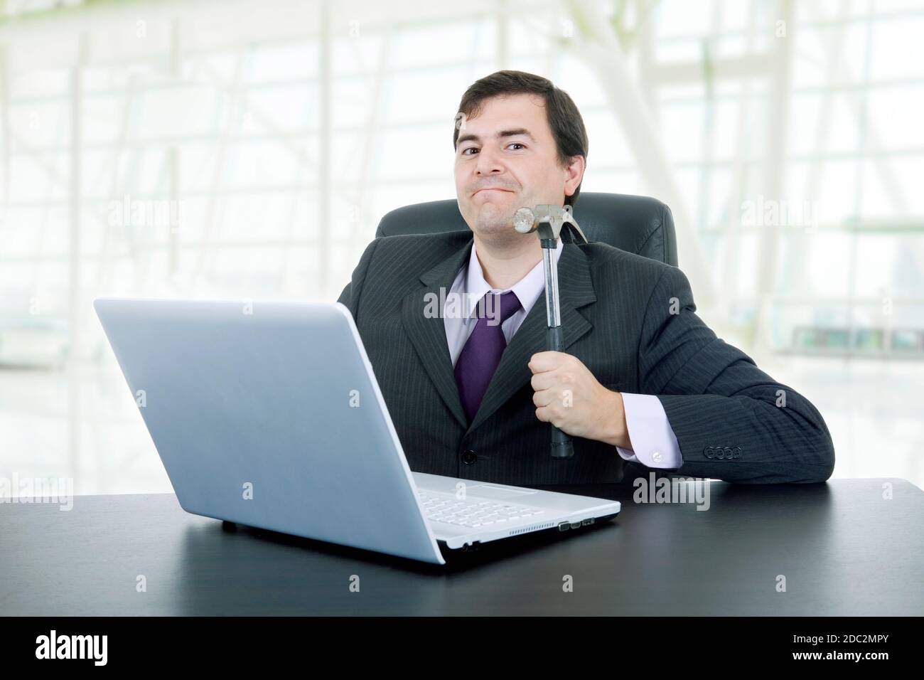 Man smashing computer with hammer hi-res stock photography and images ...