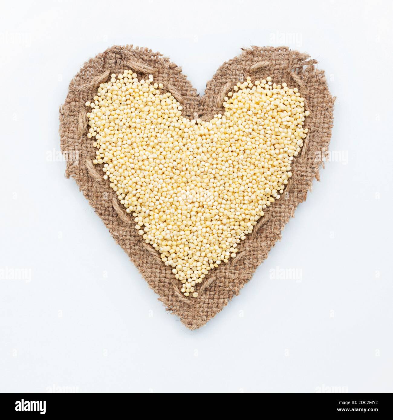Frame in the shape of heart with millet, on a white background Stock ...