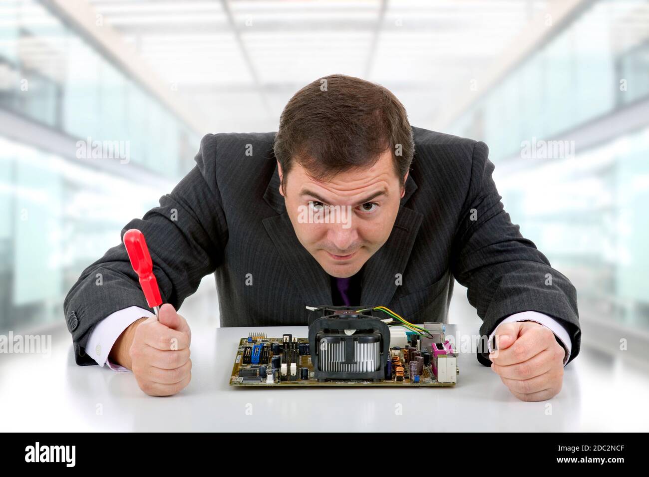 Computer engineer working in a motherboard at the office Stock Photo ...