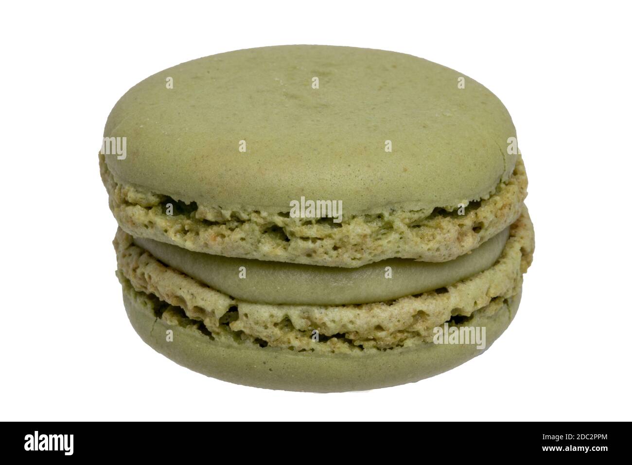 Macaron isolated. Close-up of a single original french green pistachio ...