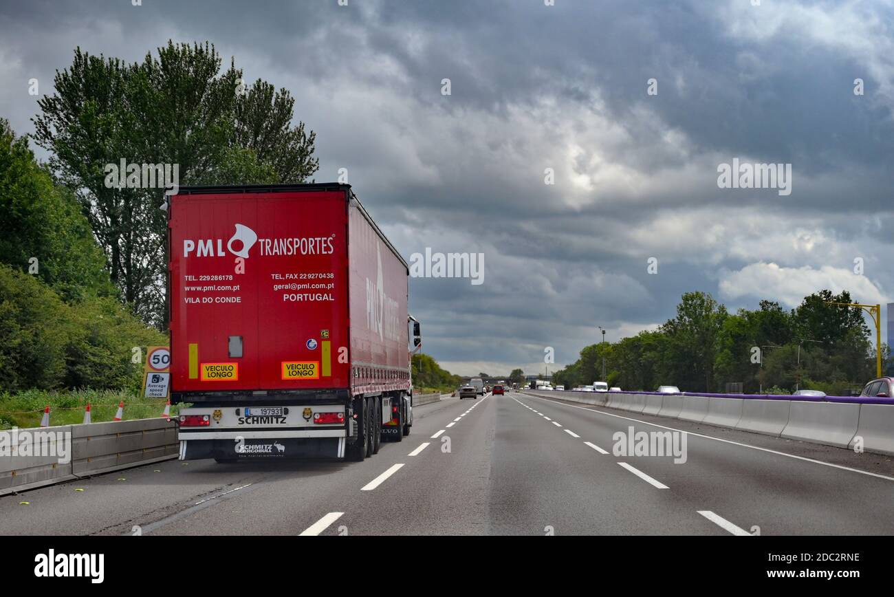 Drivers eye view driving in the middle lane of a motorway with a fifty ...