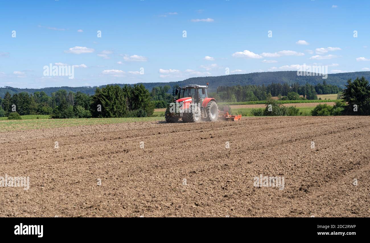 Tractor With Harrow On A Field High Resolution Stock Photography and ...