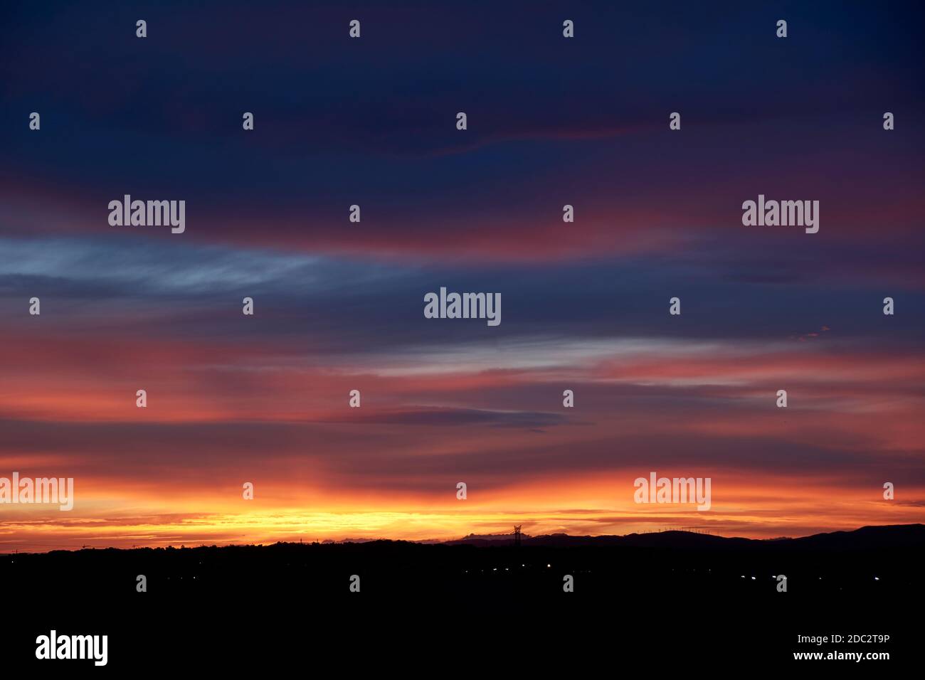 Sunset. Heaven, orange sky. Sun rays. Wallpaper. Clouds Stock Photo - Alamy