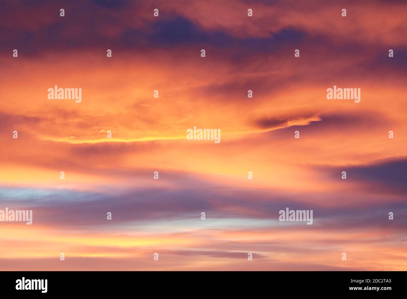 Sunset. Heaven, orange sky. Sun rays. Wallpaper. Clouds Stock Photo - Alamy