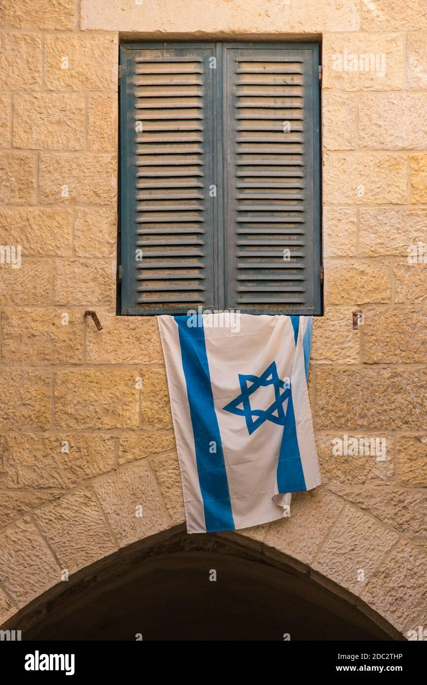 Israel, Jerusalem, Isreali flag hangs outside window shutter in Jewish ...
