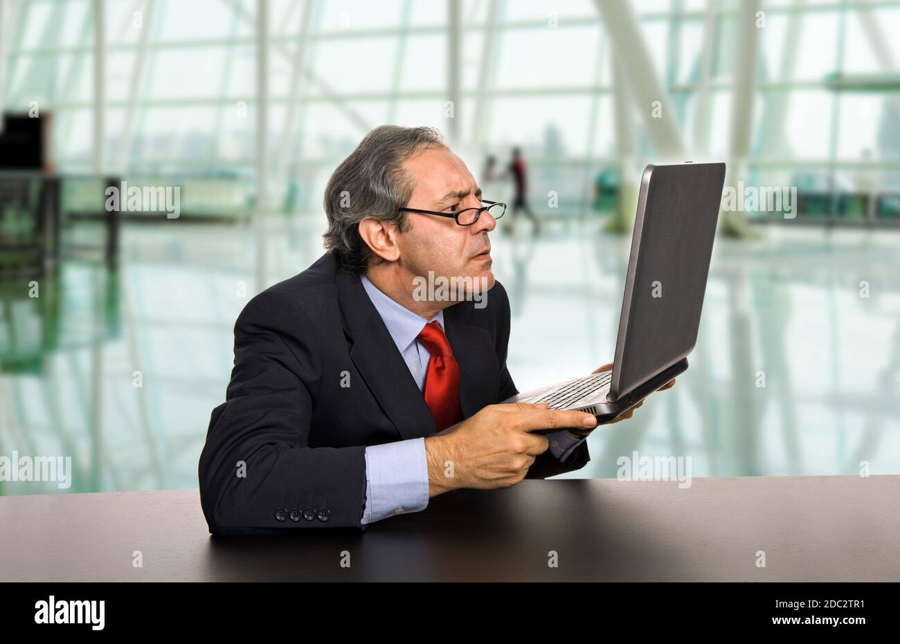 mature business man working with his laptop Stock Photo - Alamy