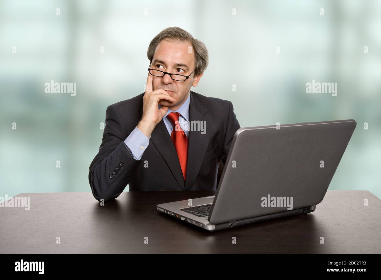 mature business man working with his laptop Stock Photo - Alamy
