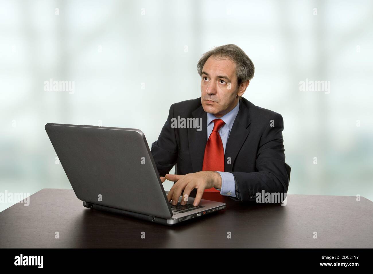 mature business man working with his laptop Stock Photo - Alamy
