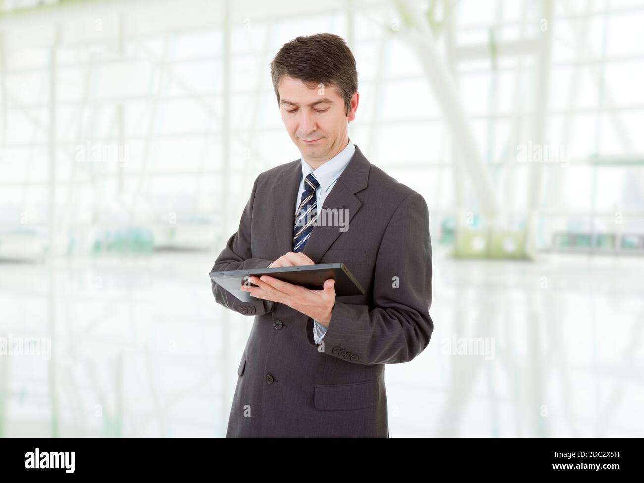 businessman using touch pad of tablet pc, at the office Stock Photo - Alamy
