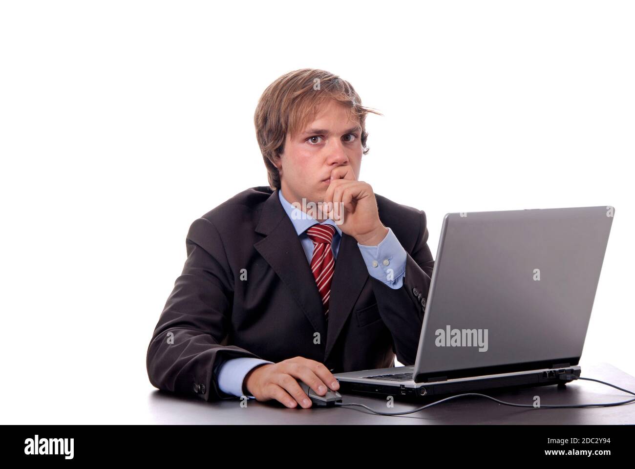 young man wondering and working with is laptop Stock Photo - Alamy