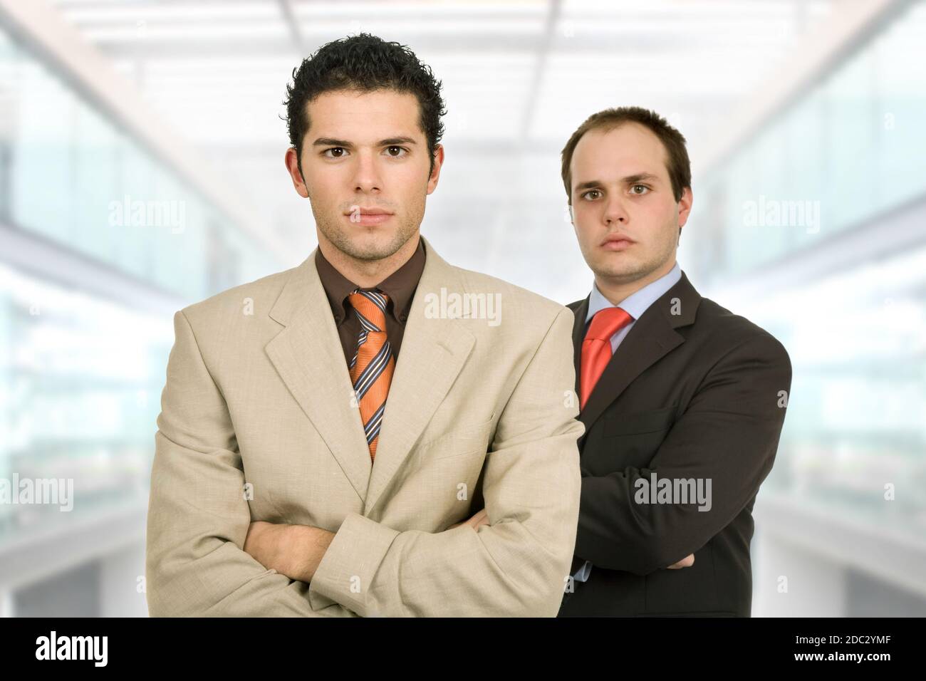 two young business men portrait at the office Stock Photo - Alamy