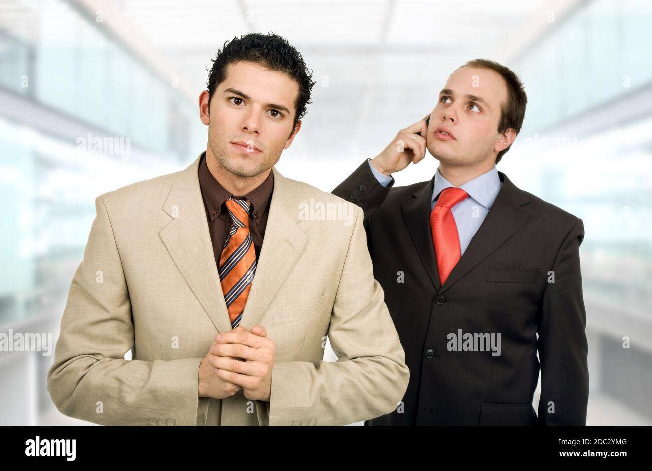 two young business men portrait at the office Stock Photo - Alamy