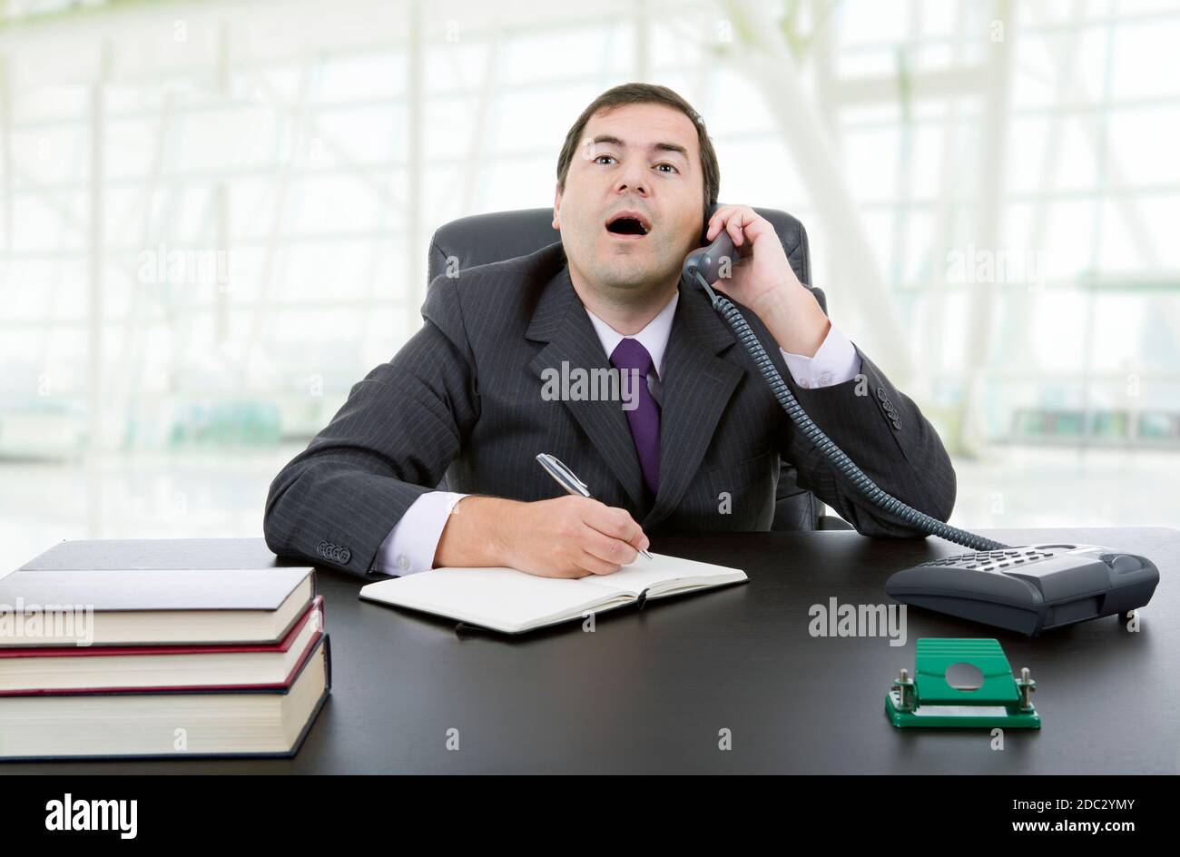 businessman writing on a desk at the office Stock Photo - Alamy