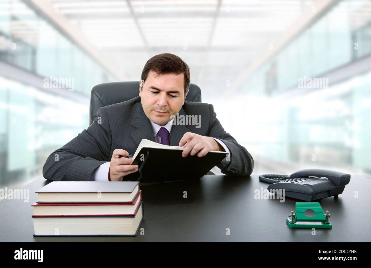 businessman writing on a desk, at the office Stock Photo - Alamy