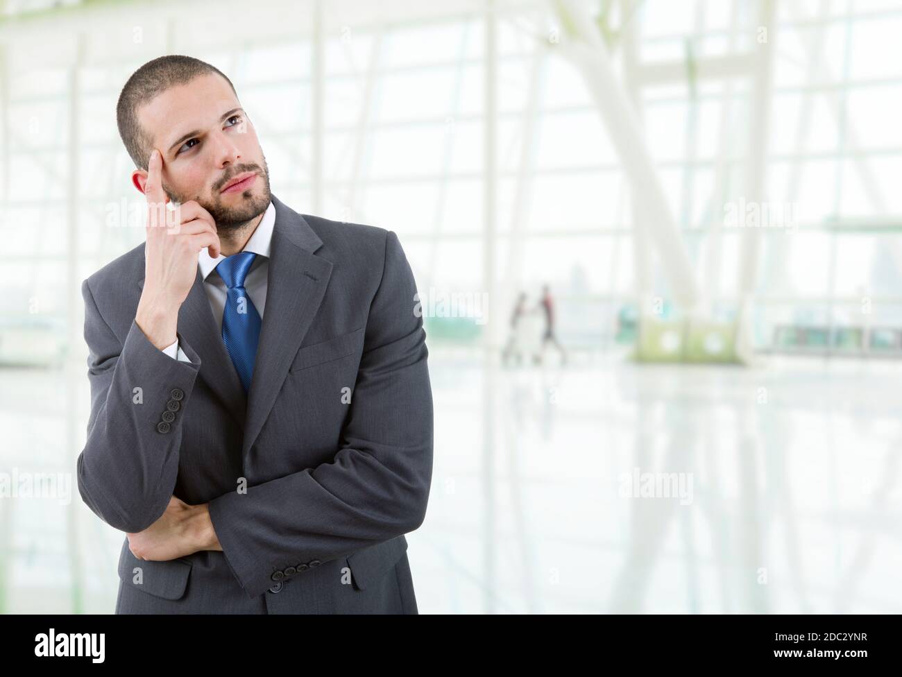 young business man thinking at the office Stock Photo - Alamy