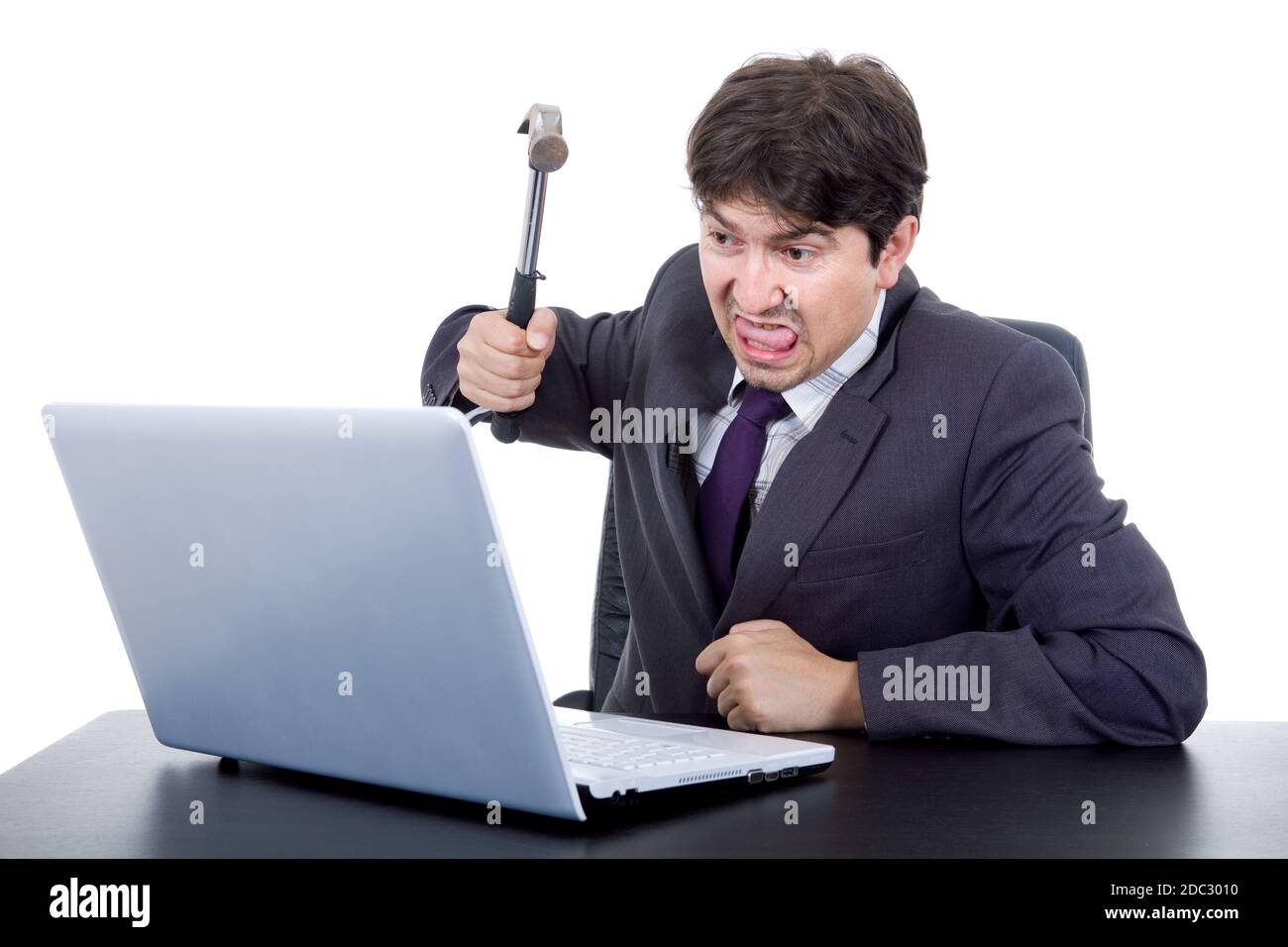 young crazy business man with a hammer smashing a laptop Stock Photo ...