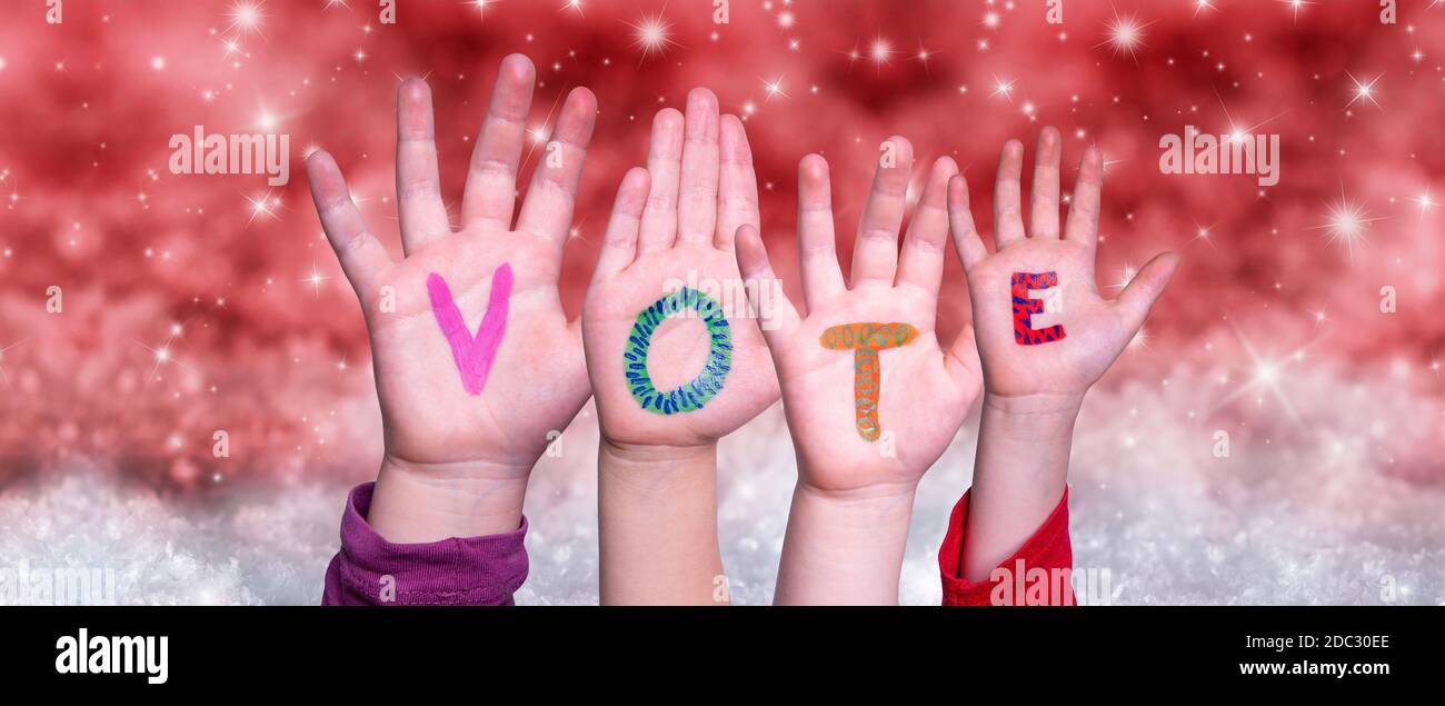 Children Hands Building Colorful English Word Vote. Red Snowy Christmas ...