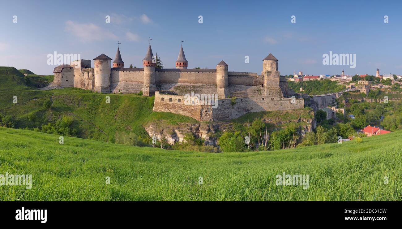 Landscape panorama of the old fortress on the hill. Evening in the old ...
