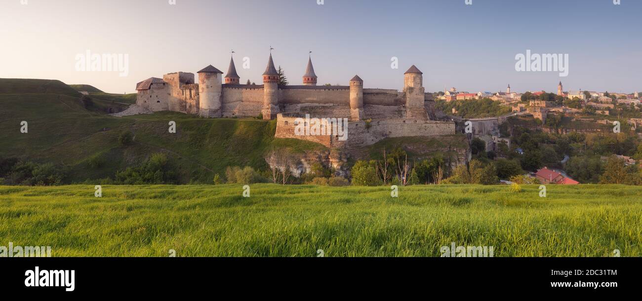 Landscape panorama of the old fortress on the hill. Evening in the old ...