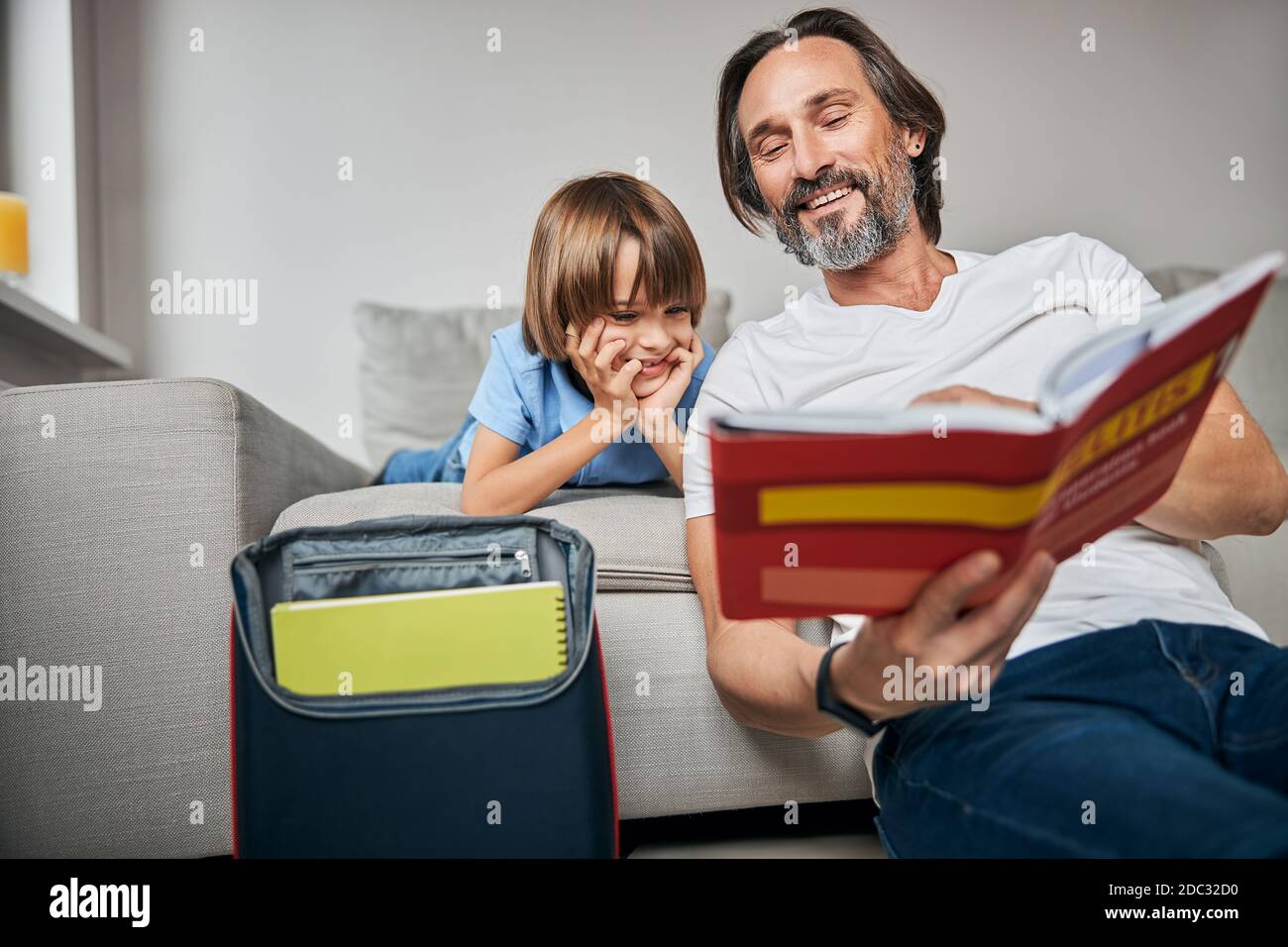 Helping boy to read hi-res stock photography and images - Alamy