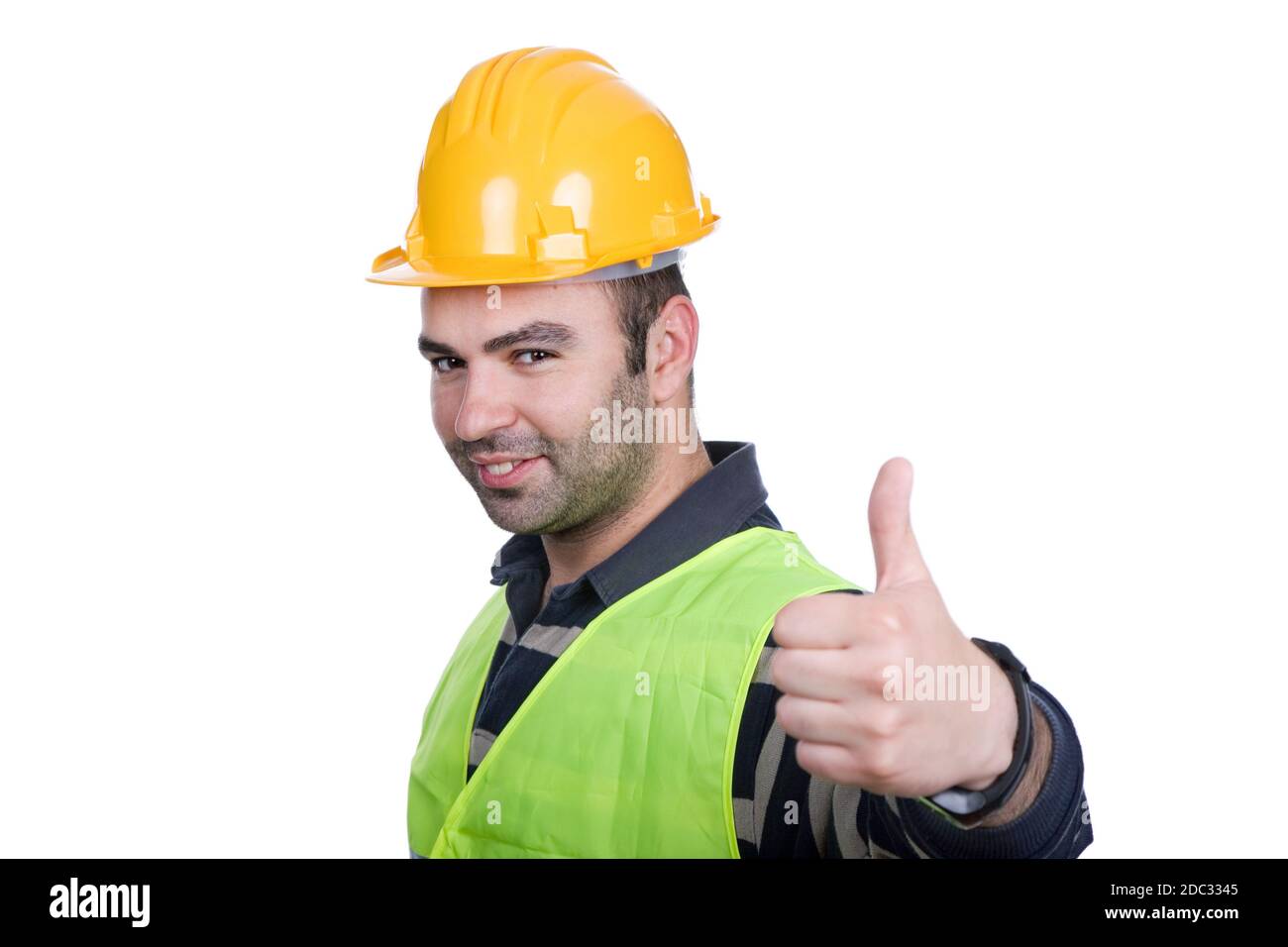 Worker wearing hard hat and going thumb up Stock Photo - Alamy