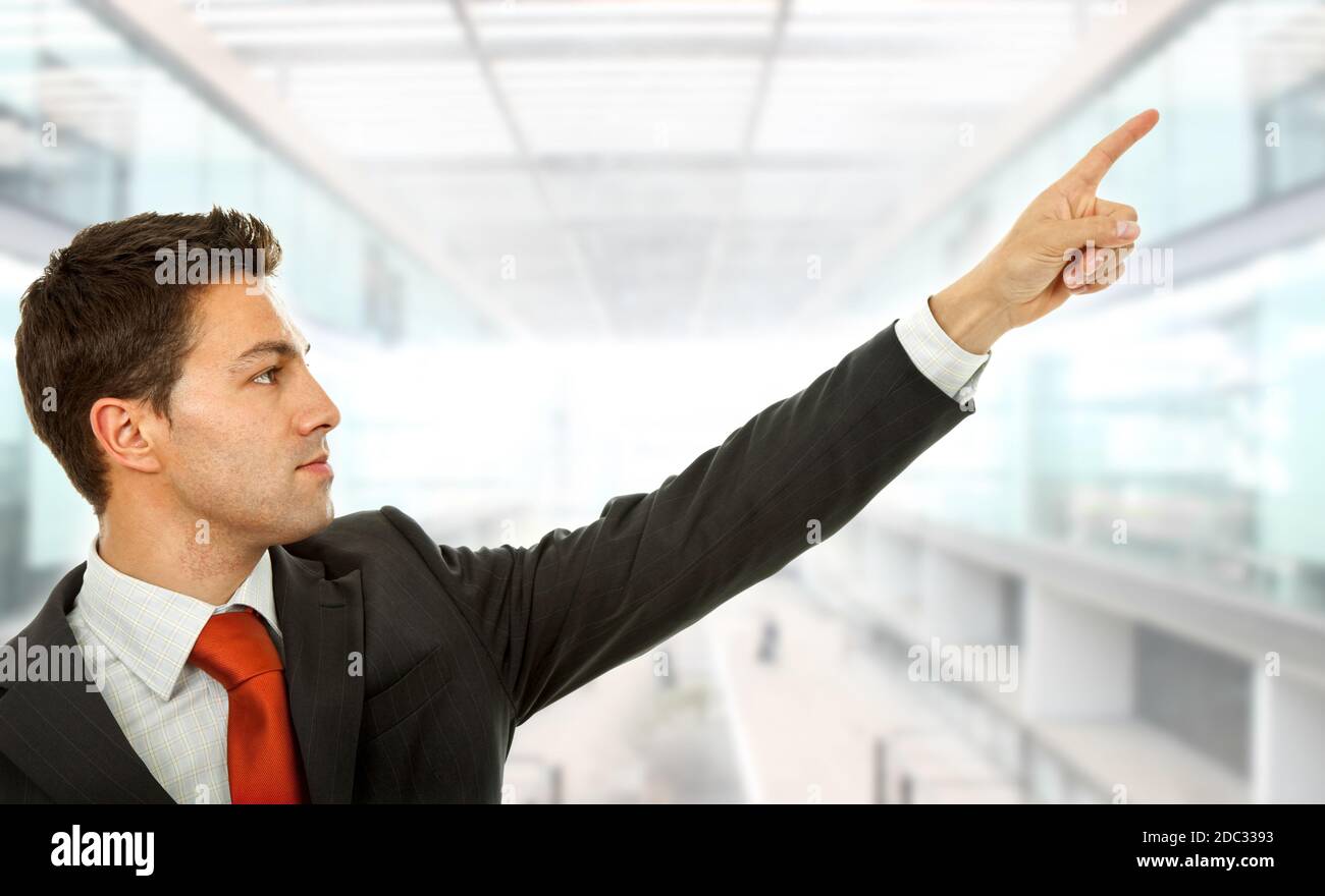 business man in a suit pointing with his finger, at the office Stock ...