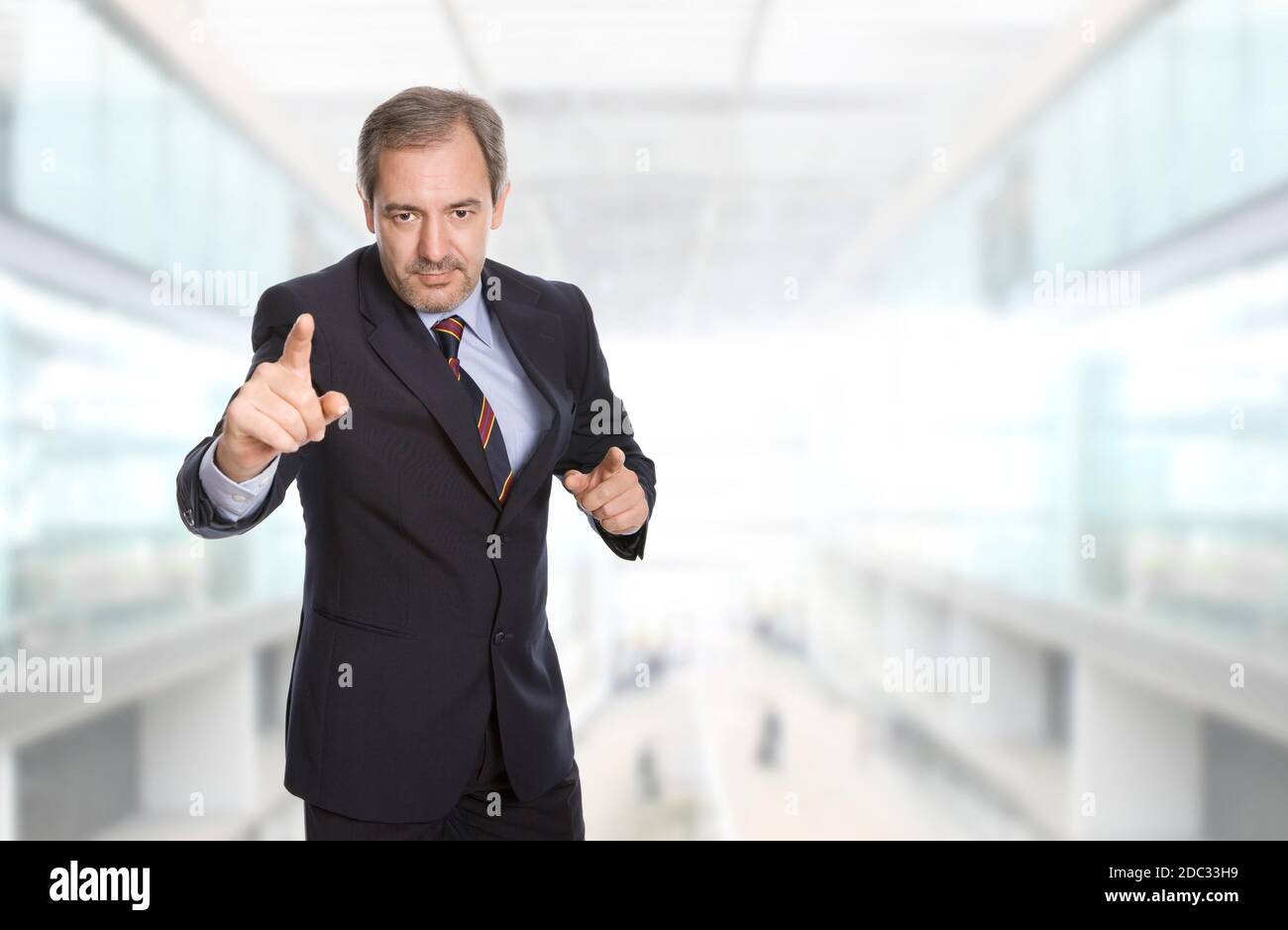 mature business man pointing, at the office Stock Photo - Alamy