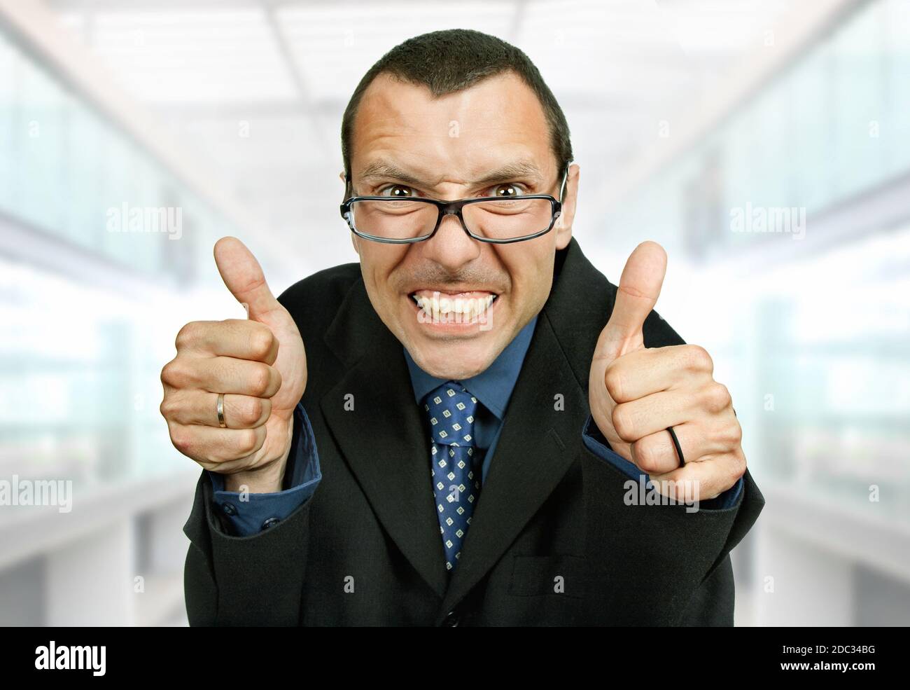 young business man playing silly, isolated on white Stock Photo - Alamy