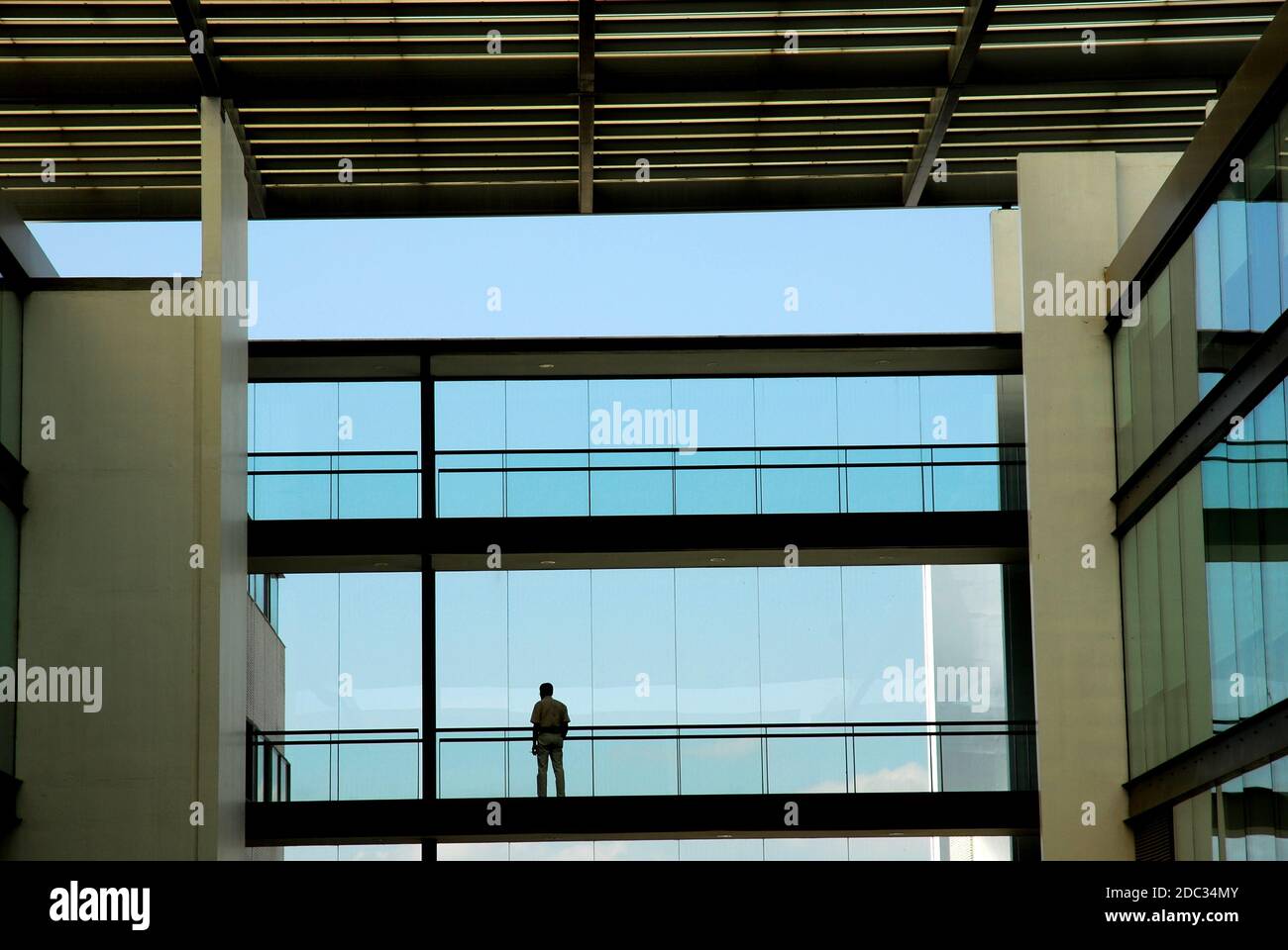 man alone in the modern office building Stock Photo - Alamy
