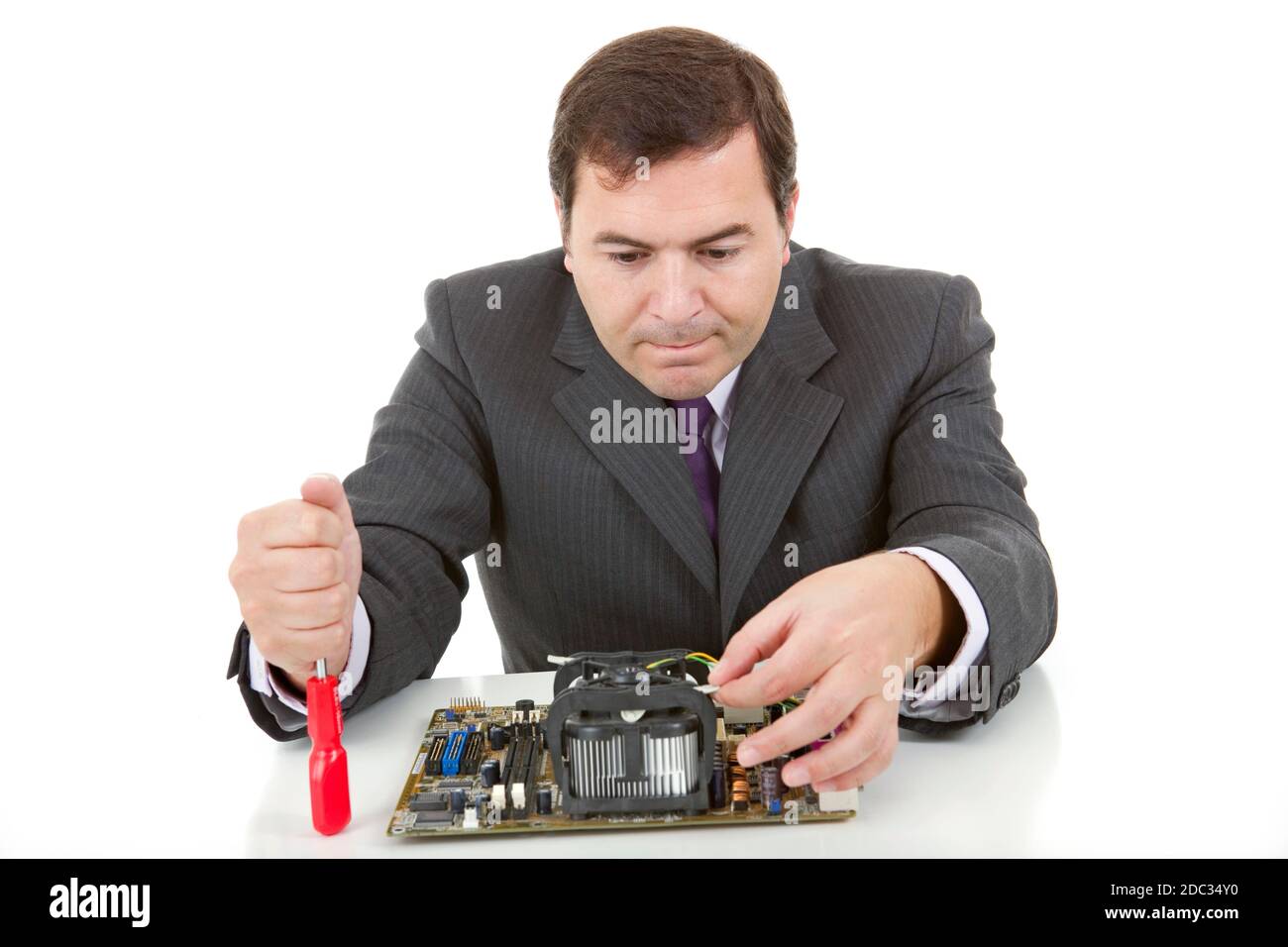 Computer engineer working in a motherboard, isolated Stock Photo - Alamy