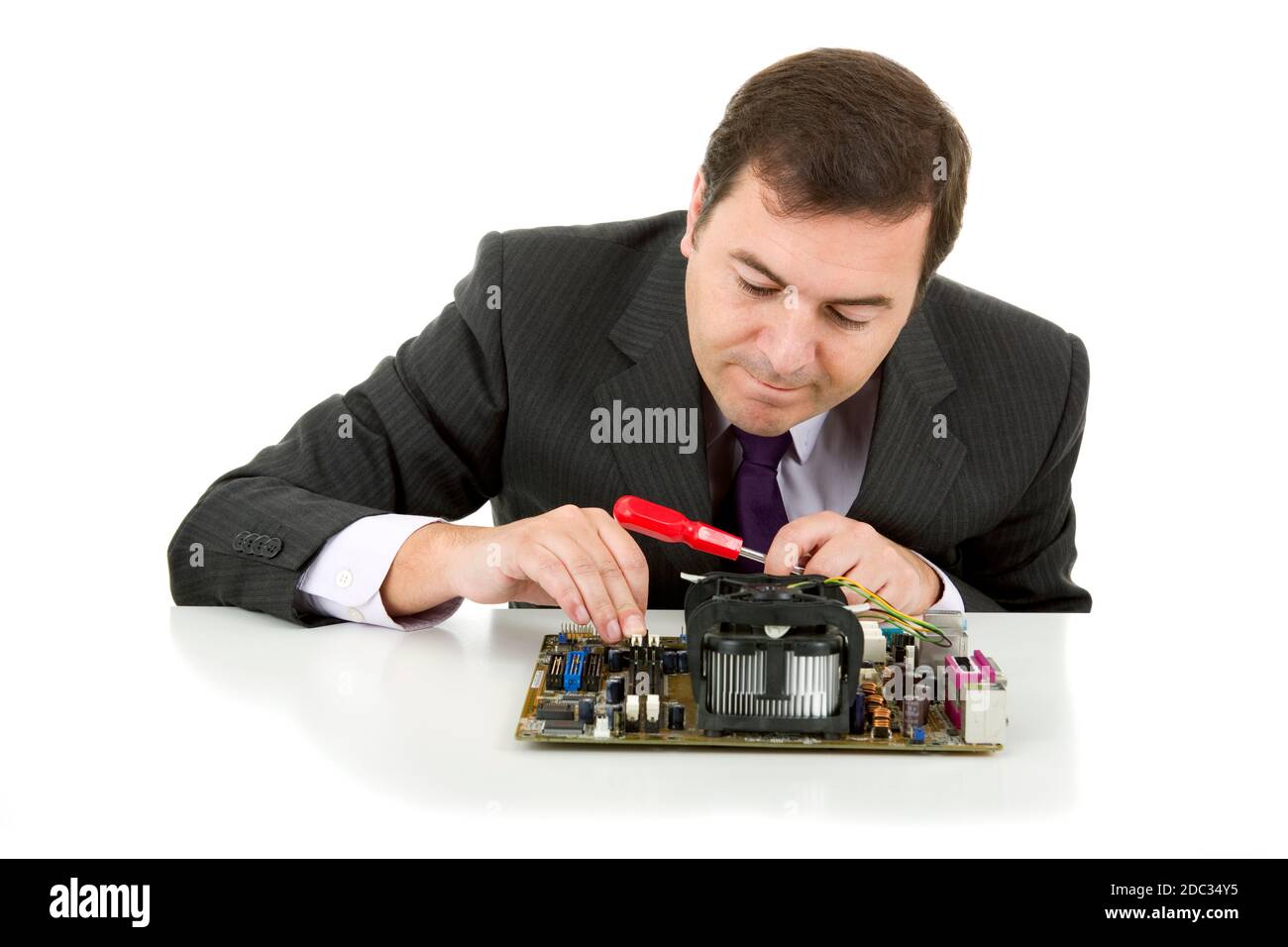 Computer Engineer working in a motherboard, isolated Stock Photo - Alamy