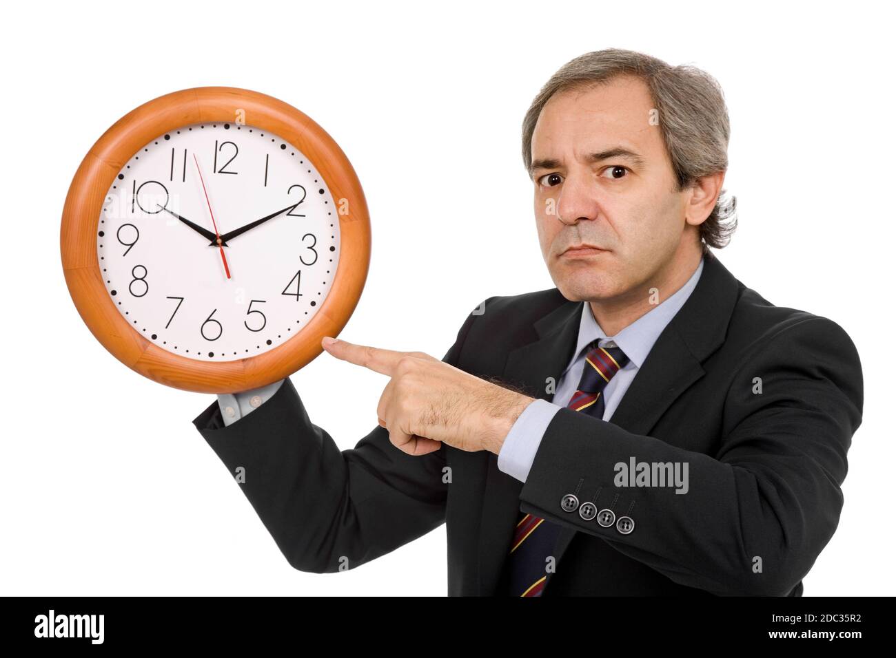 mature handsome business man holding a clock Stock Photo - Alamy