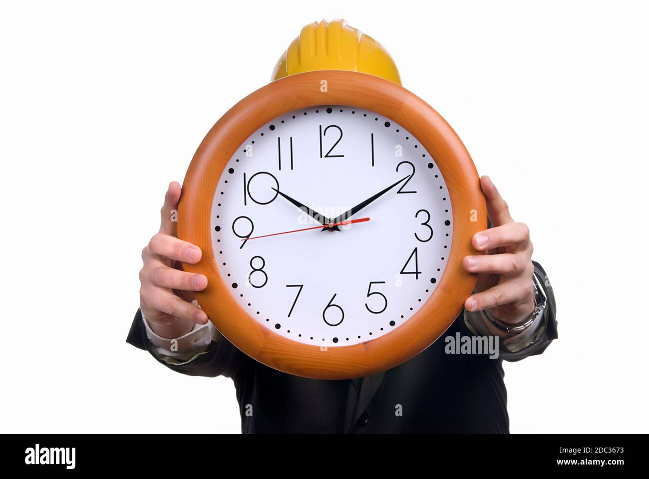 Caucasian man wearing suit holding clock in the head Stock Photo - Alamy
