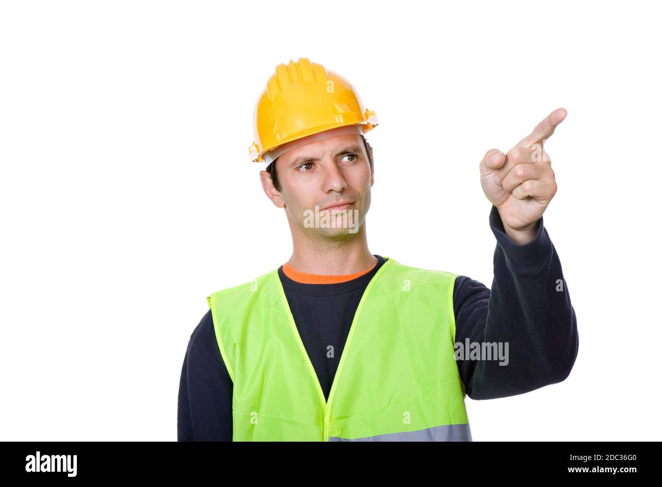 young worker pointing, in a white background Stock Photo - Alamy