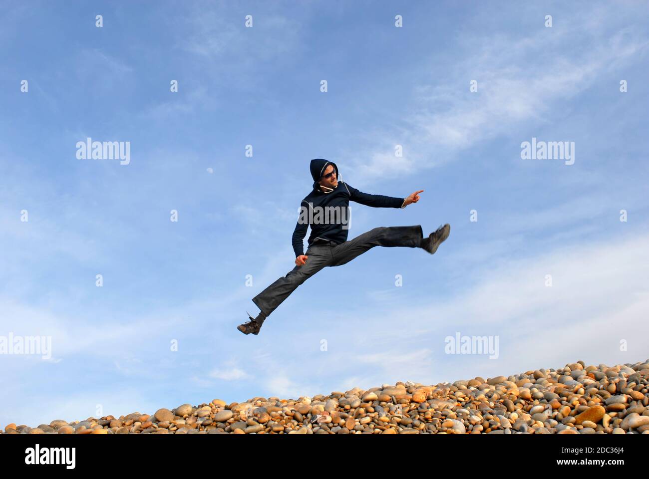 Beach exercise jumps man hi-res stock photography and images - Alamy