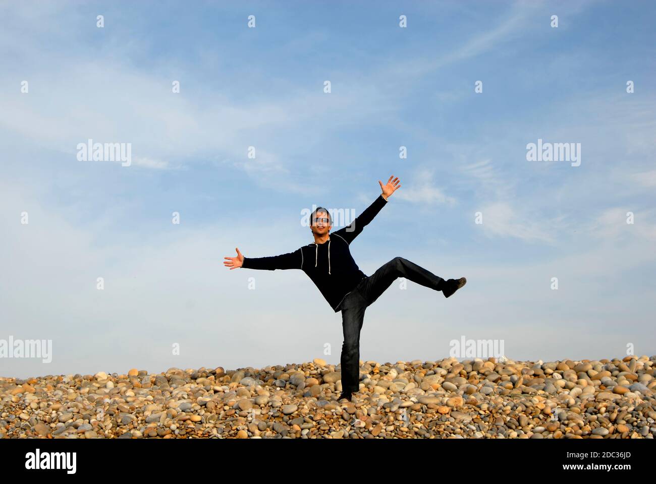 man with arms wide open at the beach Stock Photo - Alamy