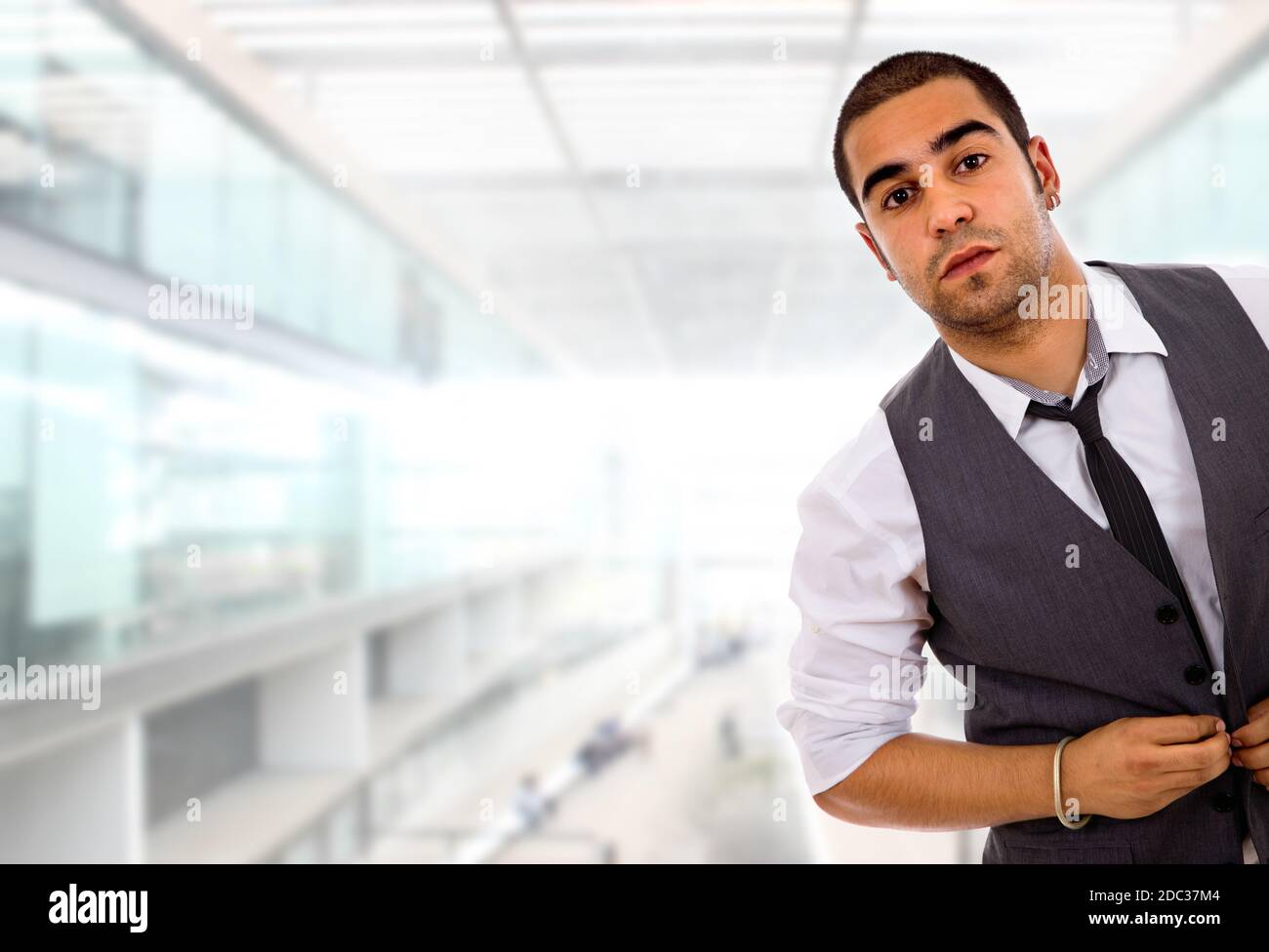 business man adjusting his clothes at the office Stock Photo - Alamy