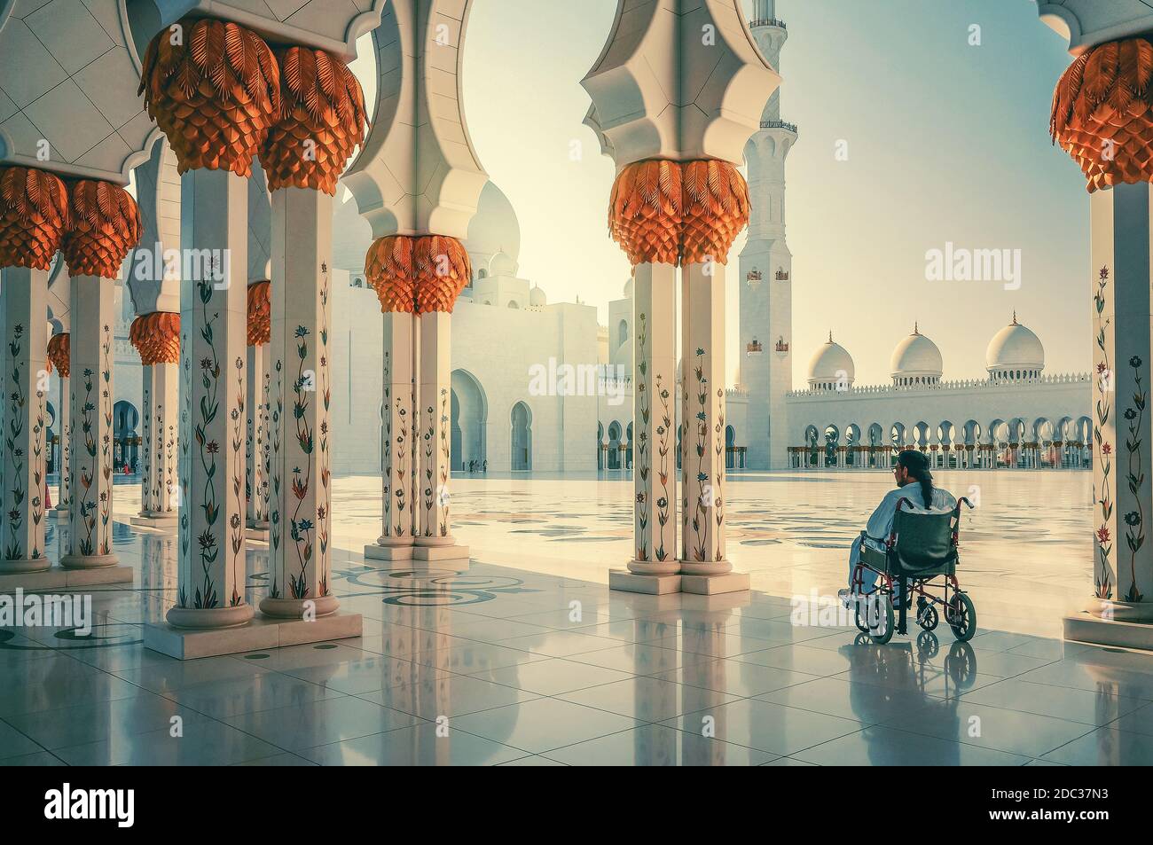 Sheikh Zayed Mosque. A disabled man is sitting in a wheelchair. A man ...