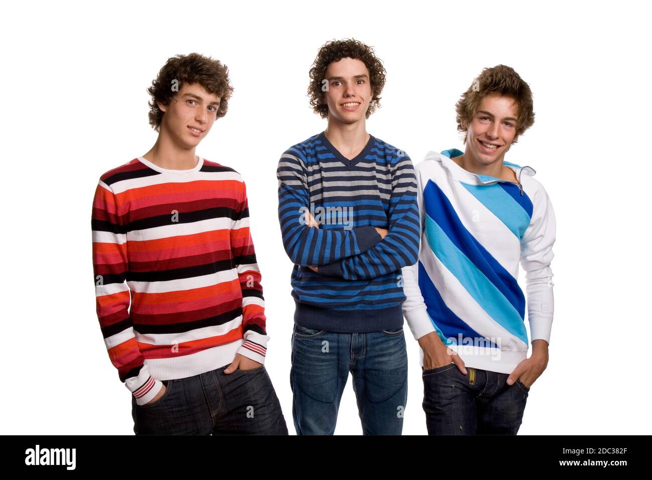 three young men standing, on a white background Stock Photo - Alamy