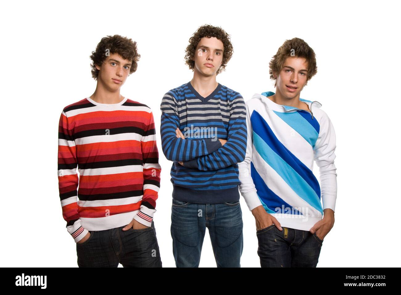 three young men standing, on a white background Stock Photo - Alamy