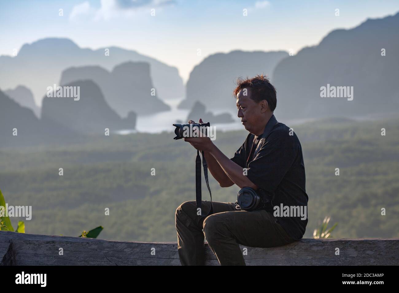 A photographer prepares a camera for taking pictures of beautiful ...