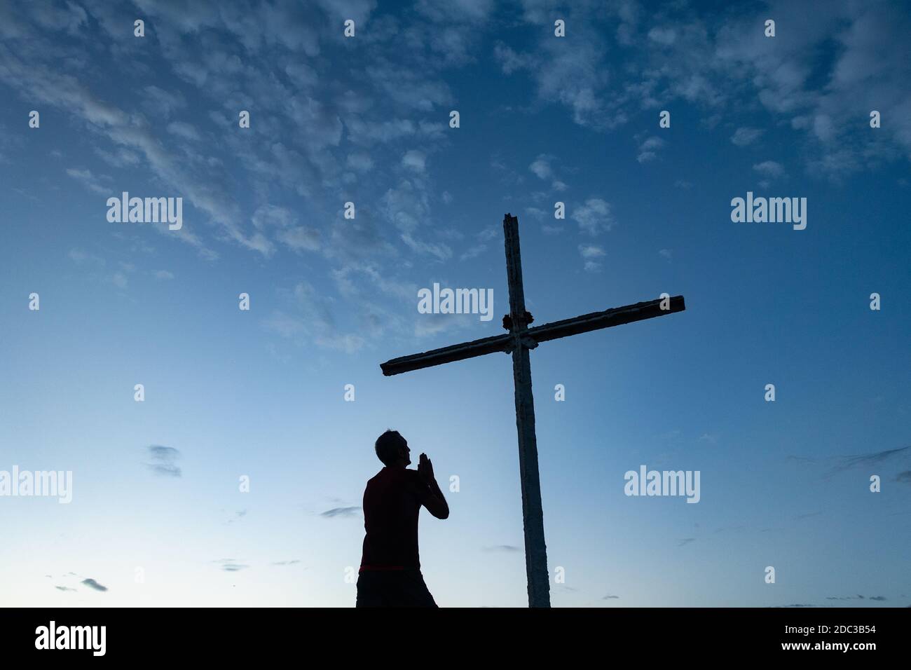 Person praying hi-res stock photography and images - Alamy