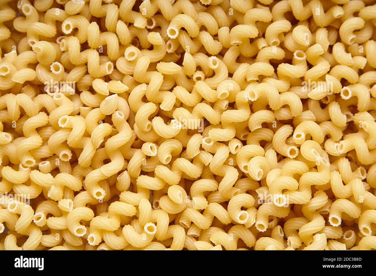 Heap of Dry Uncooked Cavatappi Italian Pasta . Food Background Stock ...