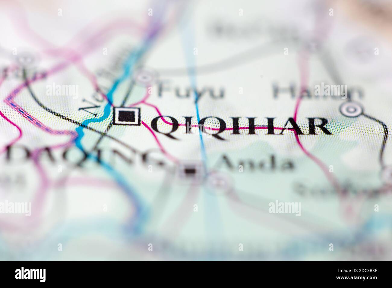 Shallow depth of field focus on geographical map location of Qiqihar ...